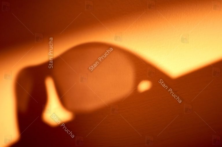 Sunglasses Shadow on Wall